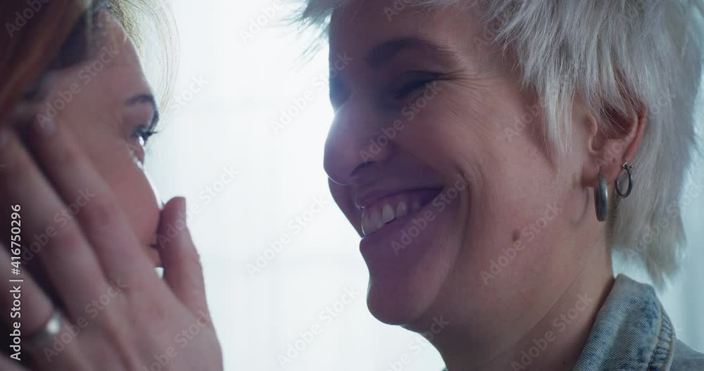 Cinematic shot of carefree happy homosexual female gay and transgender ...