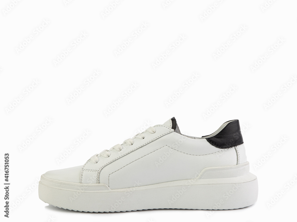 White leather sneakers with black details. Casual women's style. White ...