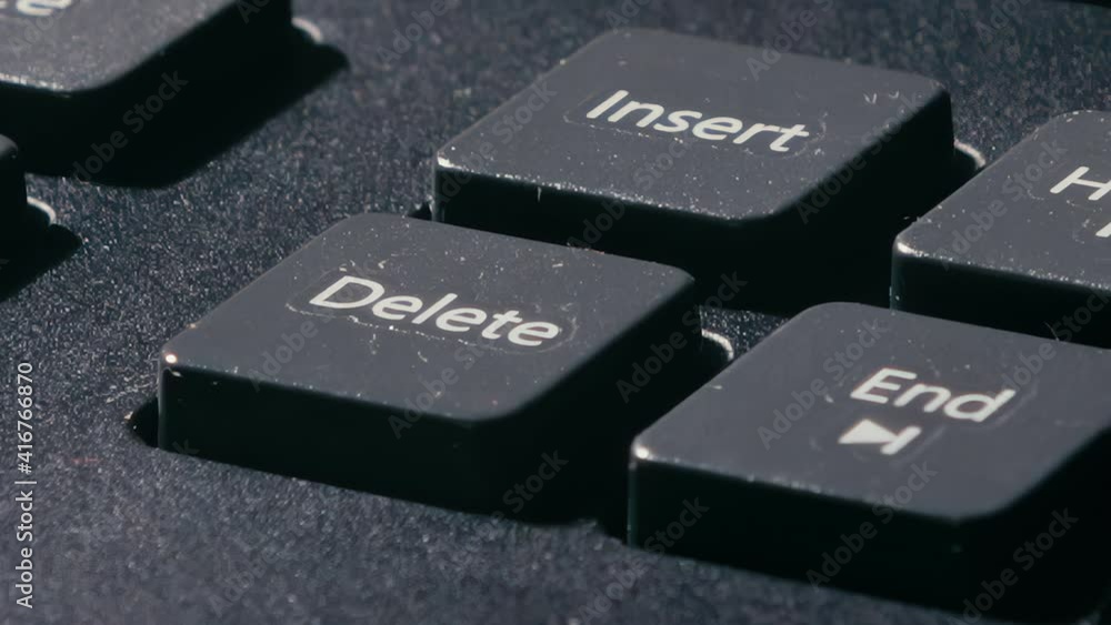 the finger presses the delete key several times. various pressing of ...