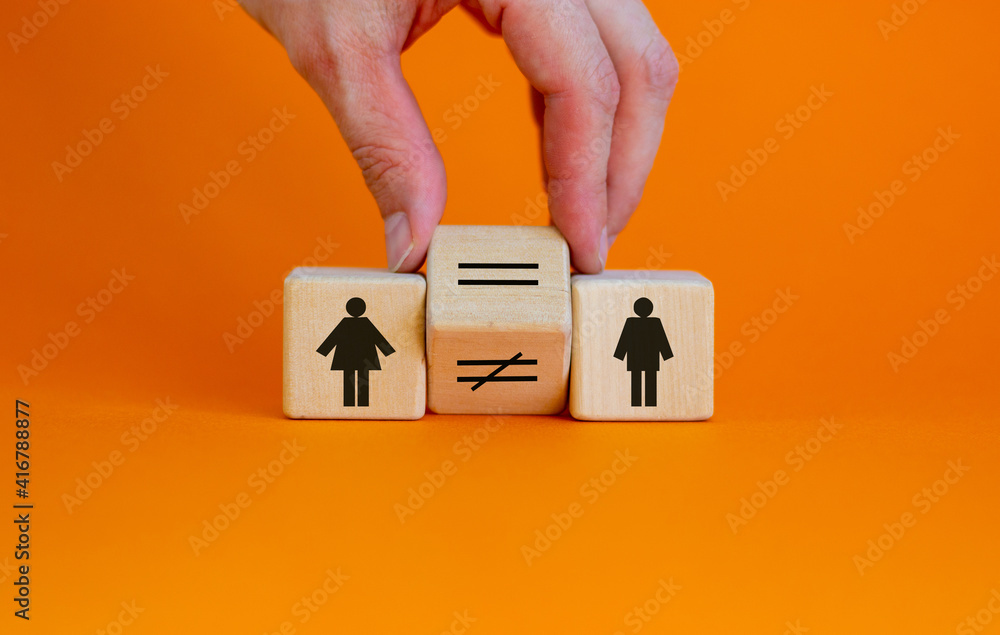 Symbol for gender equality. Hand turns a cube and changes a unequal ...
