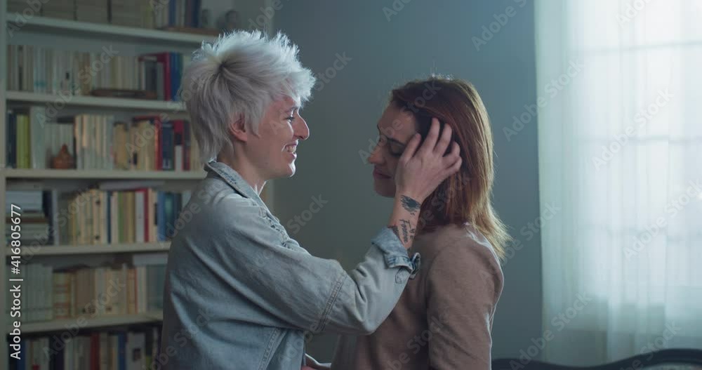 Cinematic shot of carefree happy homosexual female gay and transgender ...