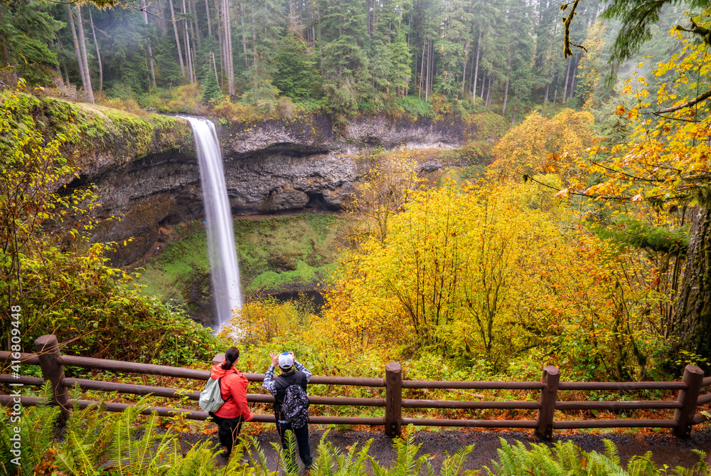 Two people taking photos of South Falls at Silver Falls State Park near ...