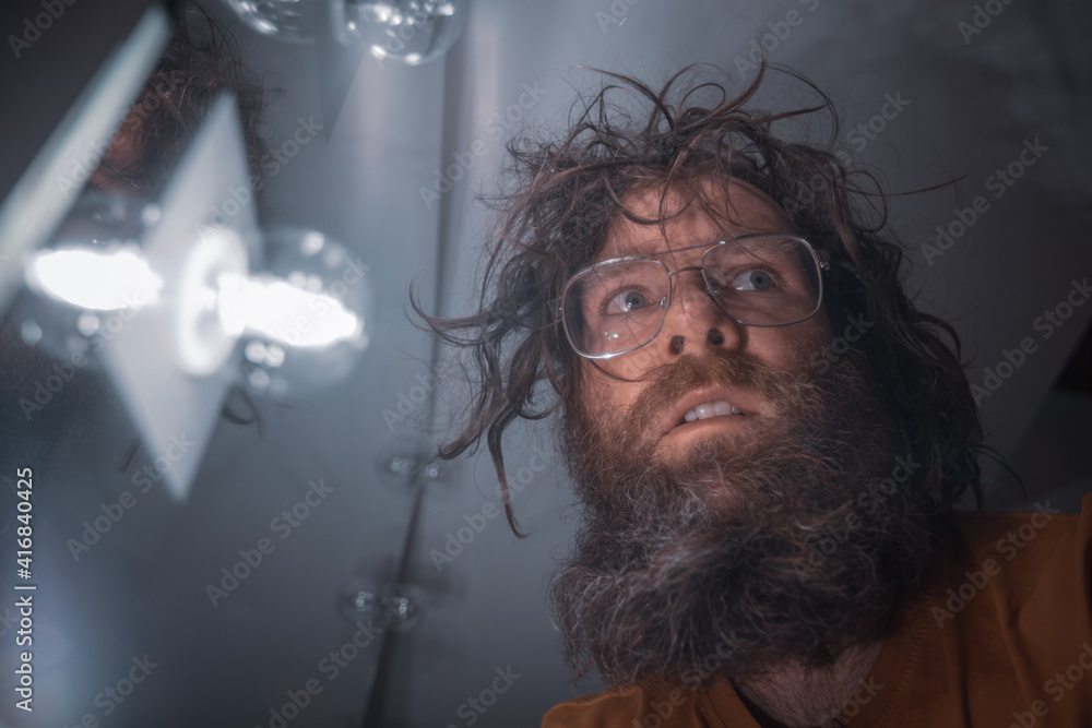 Just a weird looking bearded guy with glasses posing in the bathroom ...