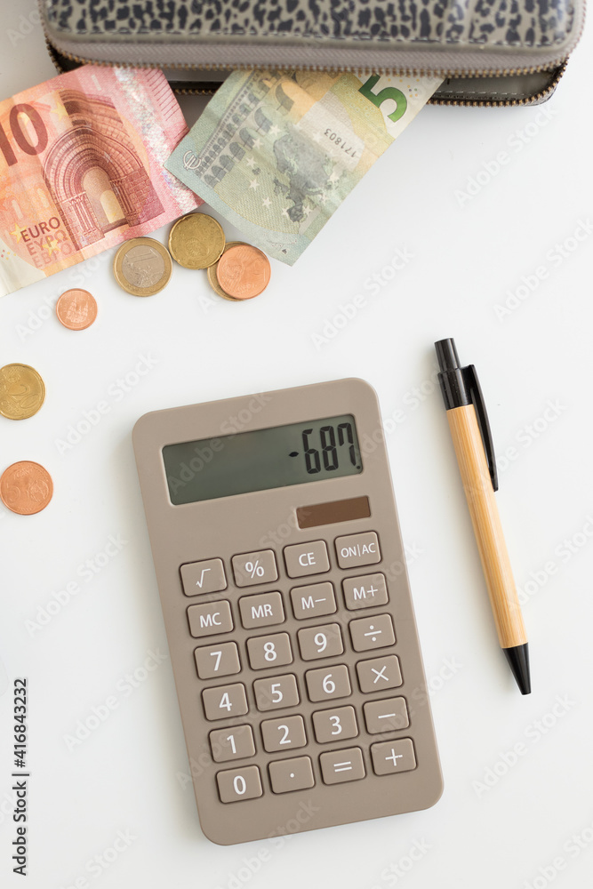 Red numbers shown in a calculator display over a white background with ...