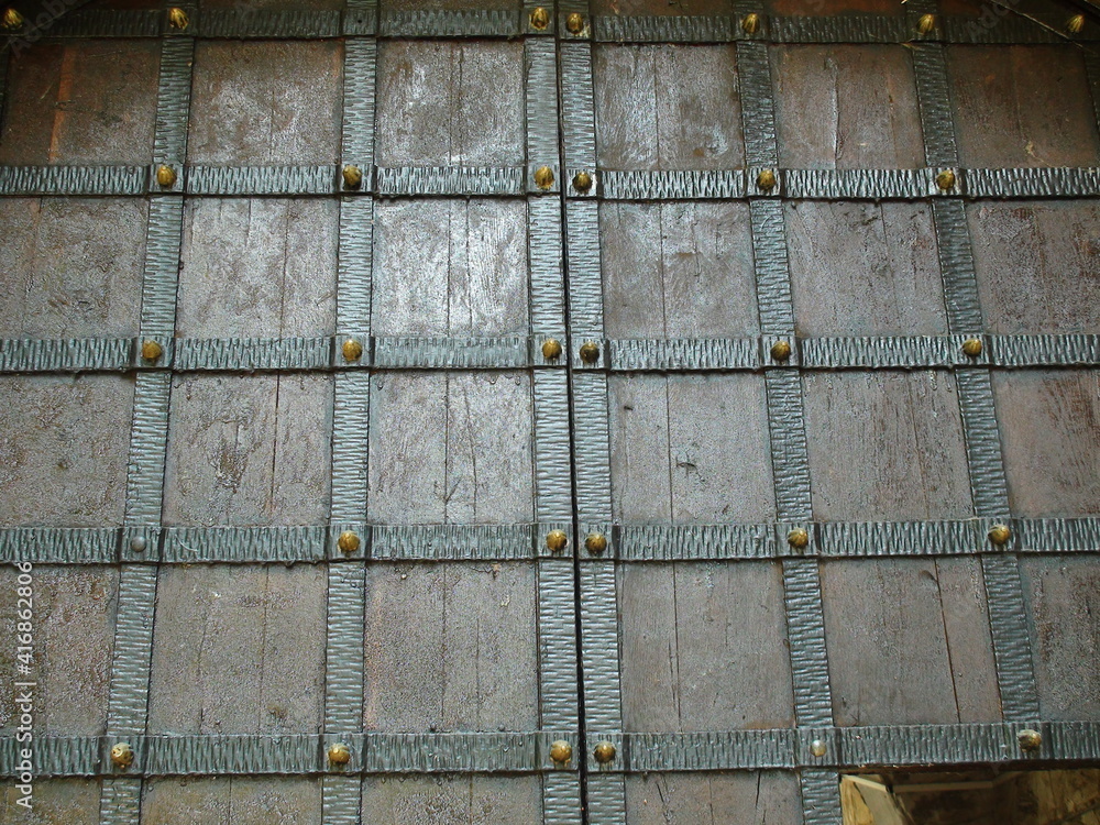 Ancient monastery doors showing the rustic wood and metal structure ...