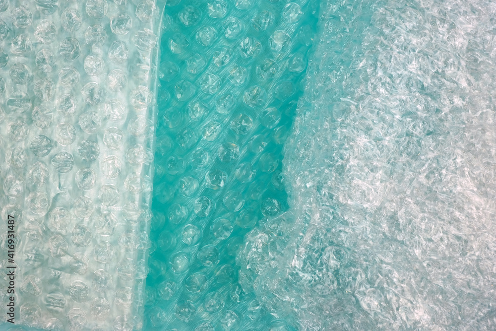 Air bubble wrap of different density and color top view. Green bubble wrap texture, background ...