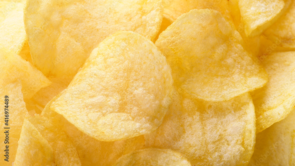 Potato chips pattern. Yellow salted potato chips as food background ...
