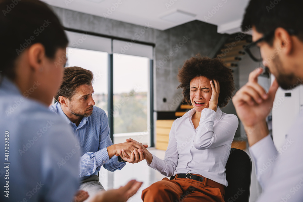 Desperate mixed race businesswoman crying because she lost her job. Her ...