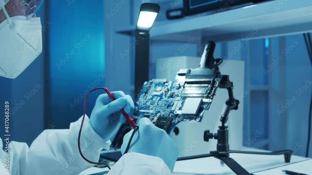 Microelectronics engineer works in a modern scientific laboratory on ...