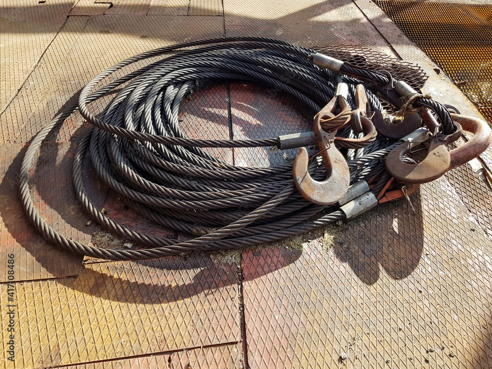 Chain hook of the tower crane for lifting cargo close-up. Rope slings ...
