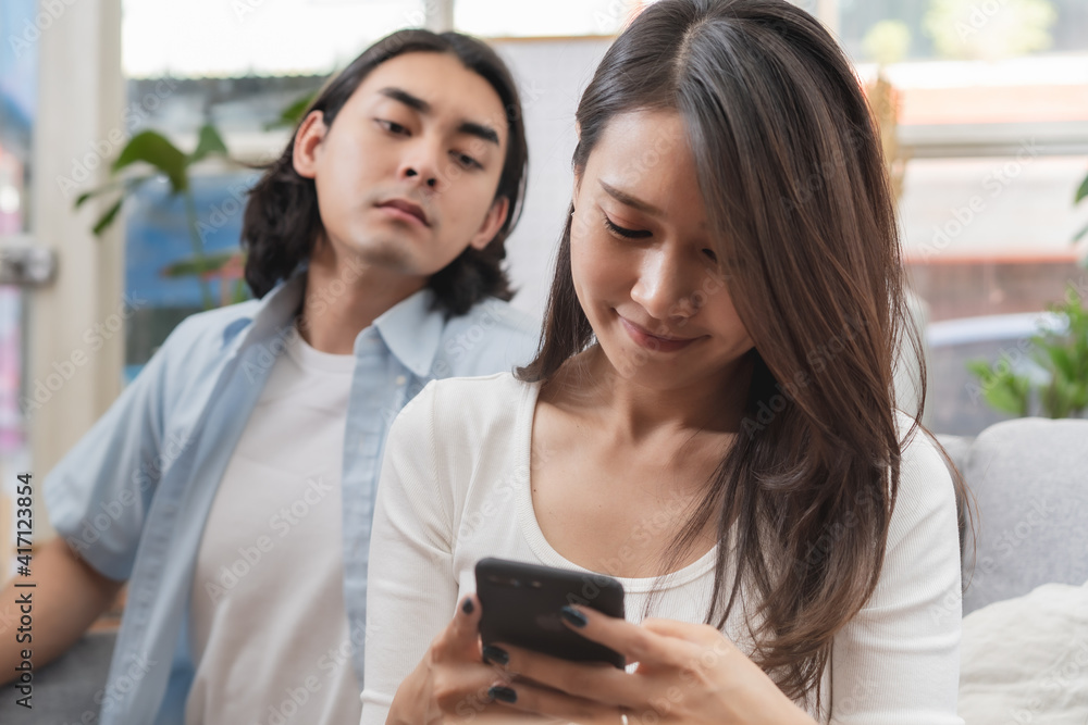 unfaithful relationship concept. asian husband suspects his wife is ...