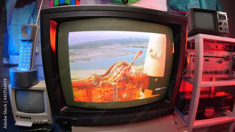 Apollo 11 moon mission rocket launch showing on a retro television CRT ...