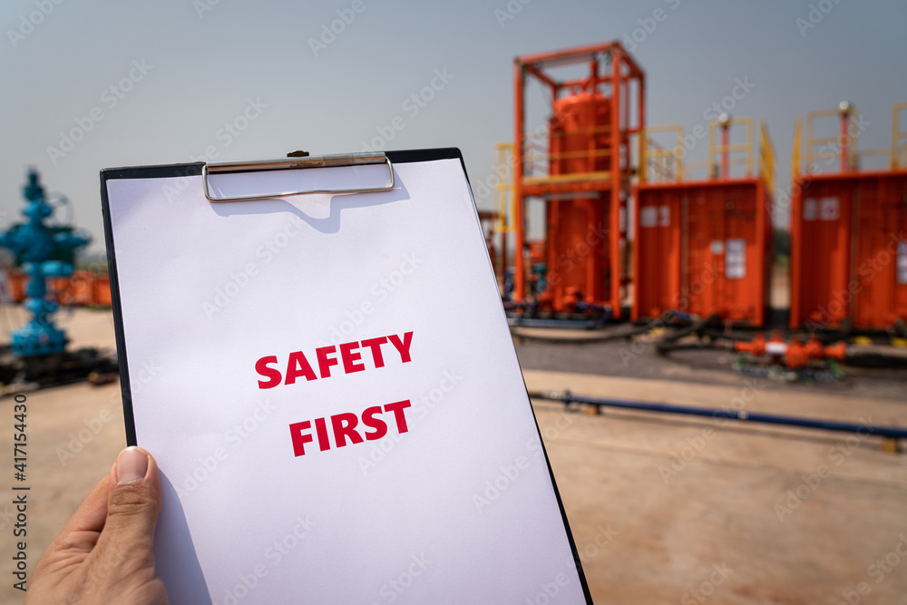 Safety first in unsafe workplace concept photo. Hand of staff is ...