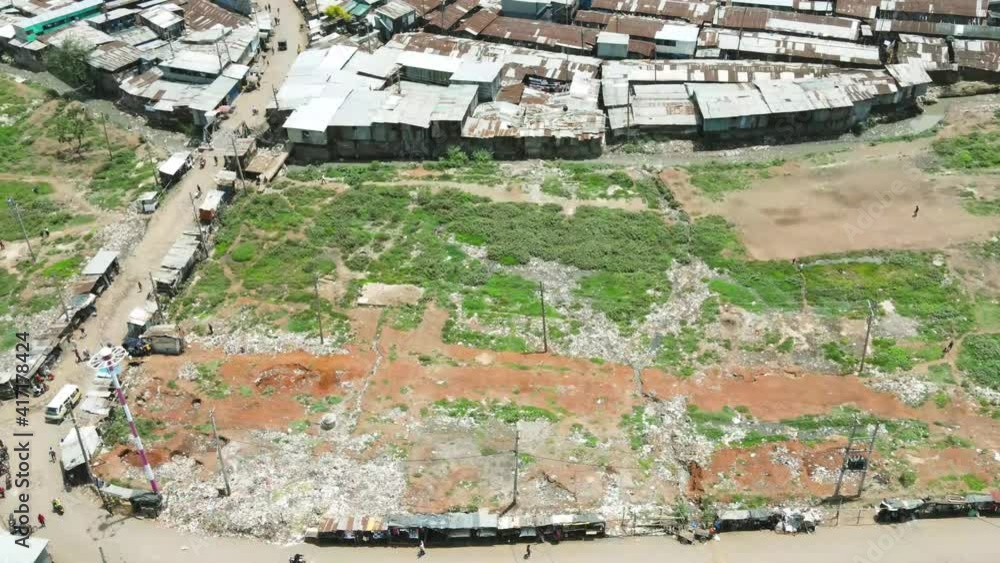Aerial view: drone flying over the dumping site of the Kibera village ...