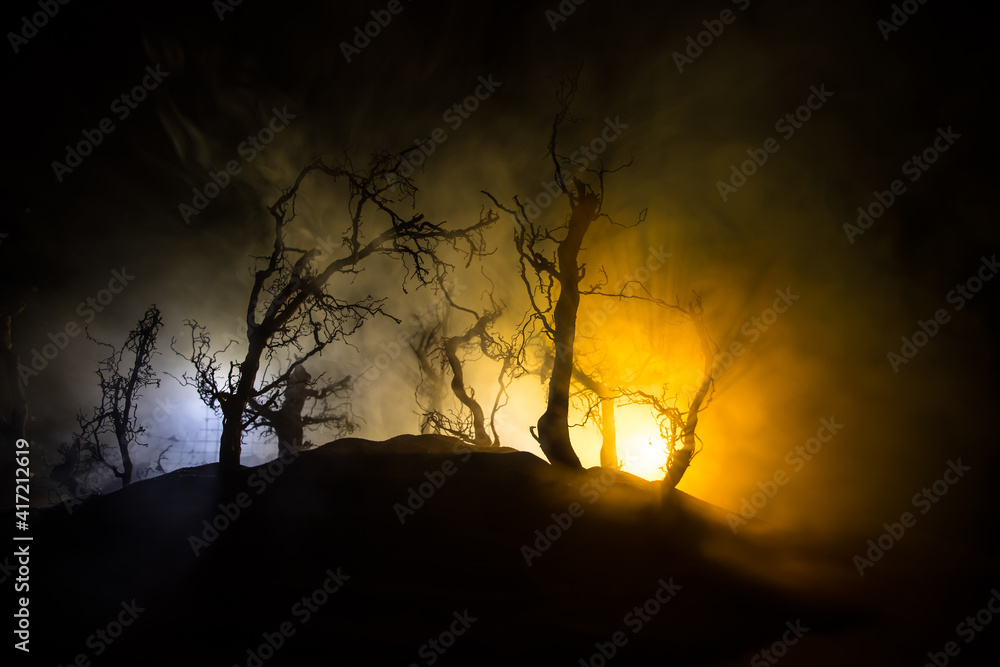 Spooky dark landscape showing silhouettes of trees in the swamp on ...