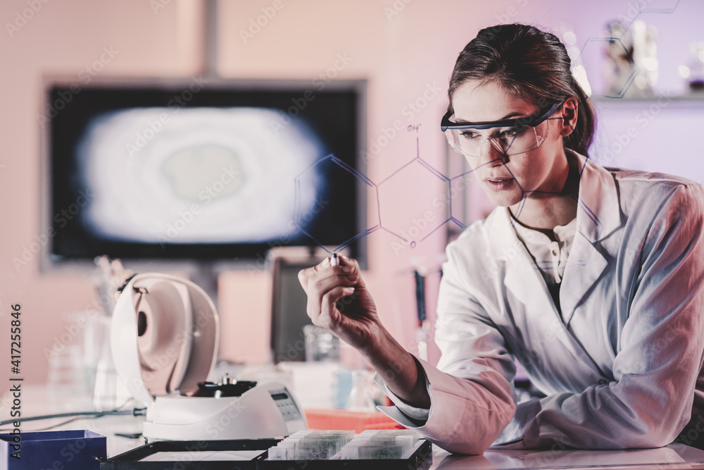 Portrait of a confident female health care expert in life science ...