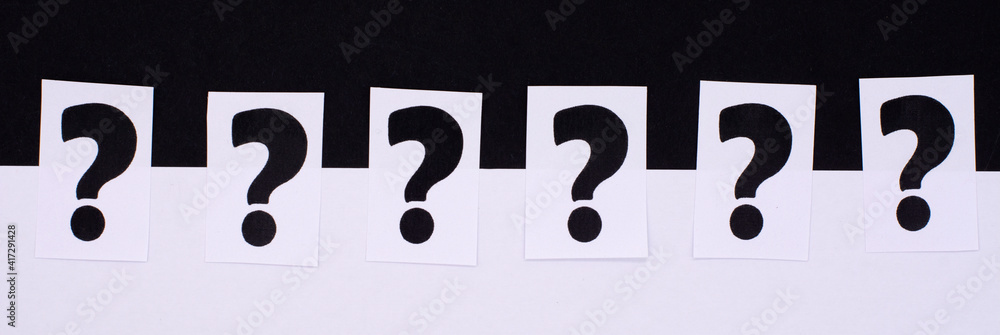 a question mark on a white sheet a black white background . FAQ ...