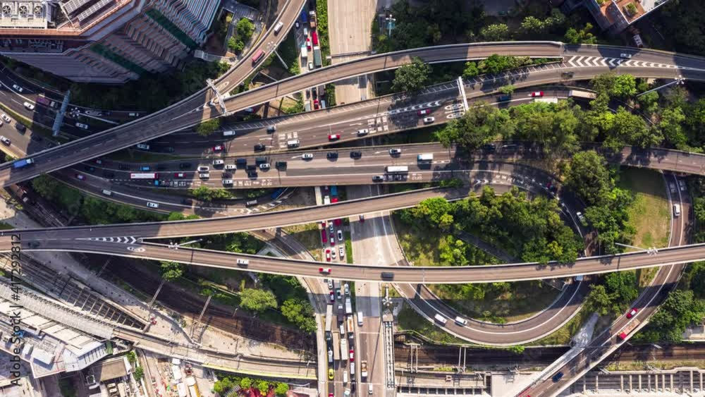 Top down view of a traffic time lapse in a busy highway intersection ...