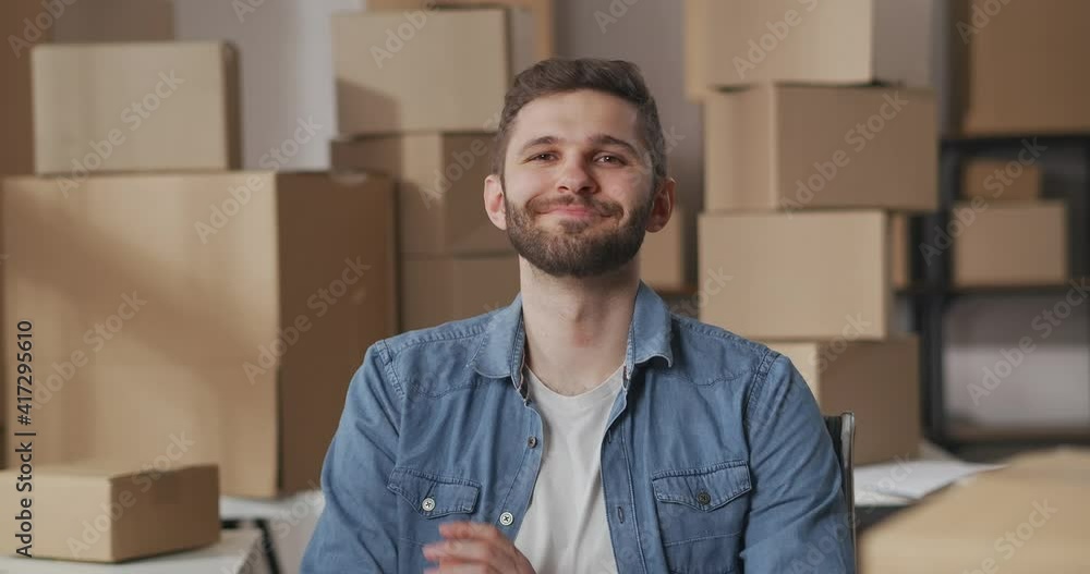 Small business owner portrait of handsome young man with beard folds ...