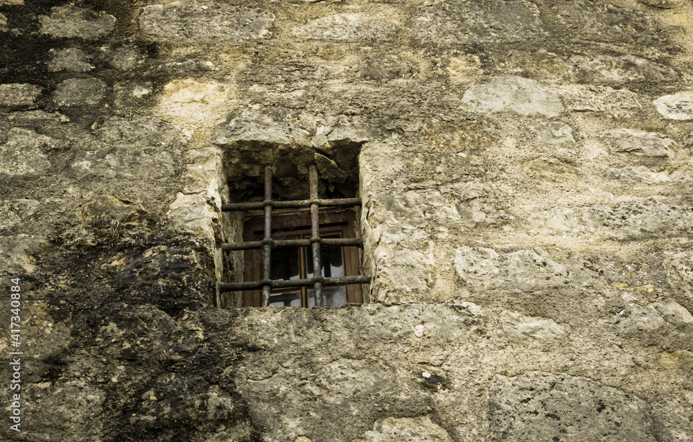 Medieval prison. Window with bars. Ancient medieval prison window from ...