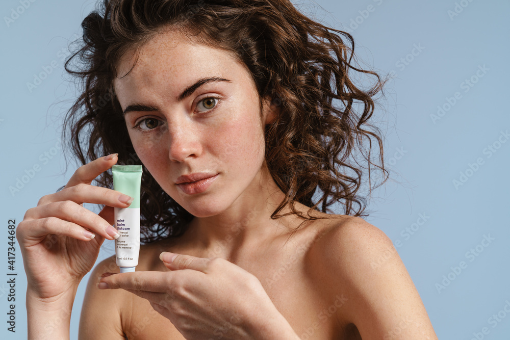 Beautiful shirtless curly girl posing with facial cream Stock Photo ...