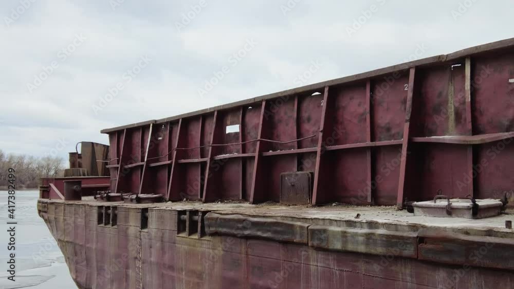 old barges at the mooring. Docked old industry river barges' side ...