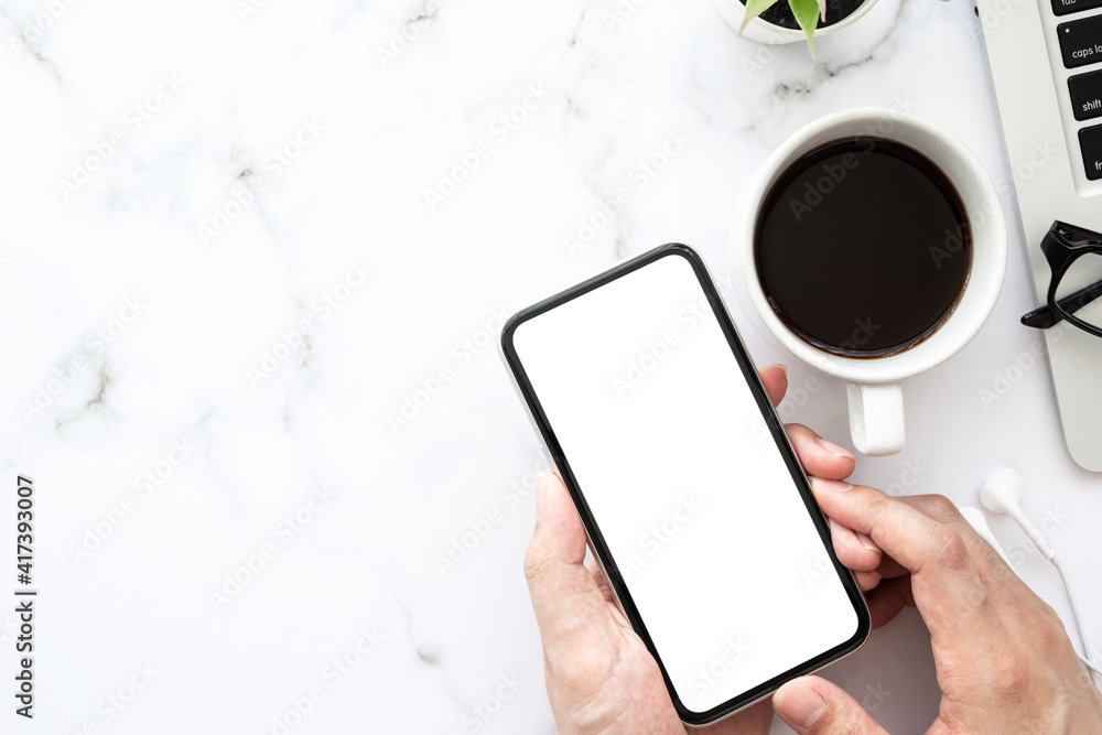 Hand holding smartphone with white blank mock up screen over white ...