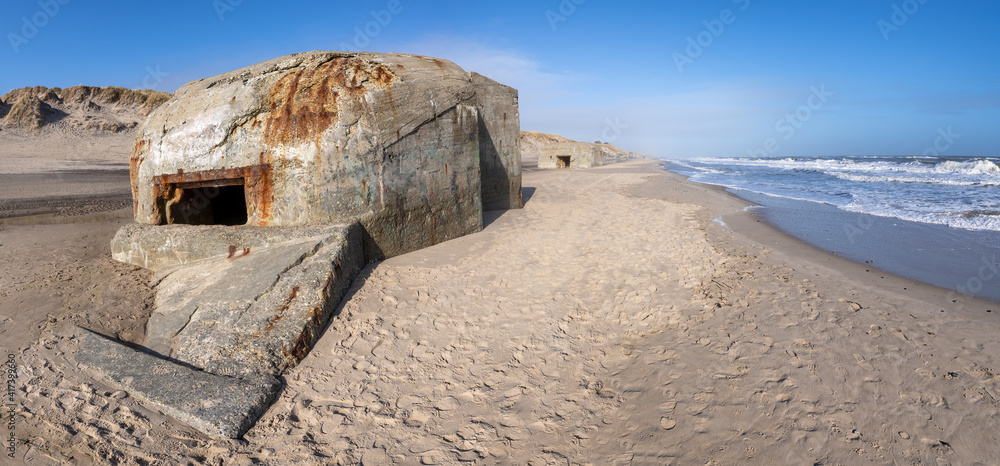 Old concrete bunkers from WWII line the beaches on the west coast of ...