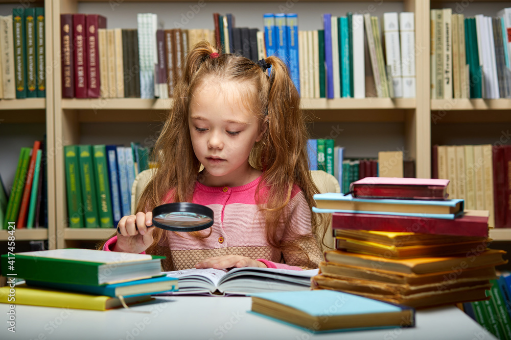 preschool girl reading book in library with patience, caucasian kid ...
