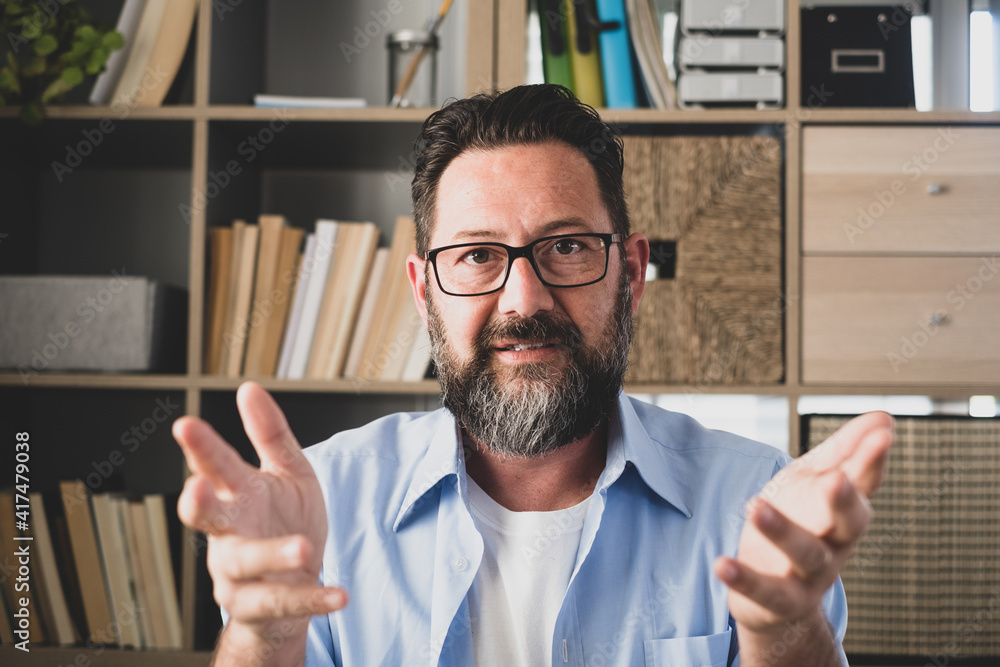 portrait and close up of one old man talking to the camera in video ...