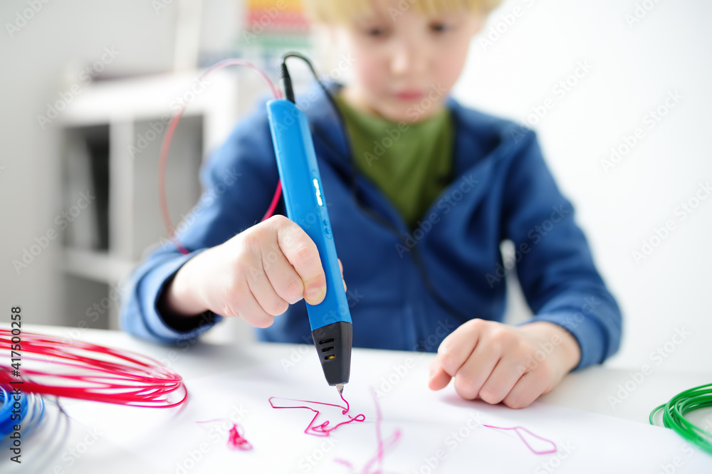 Little boy learning make model with 3d printing pen. Child playing with ...