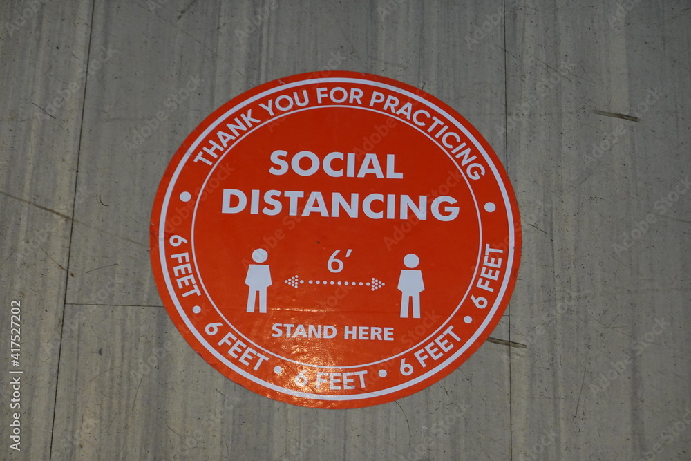 Red circle symbol sign printed on the ground at US store informing ...