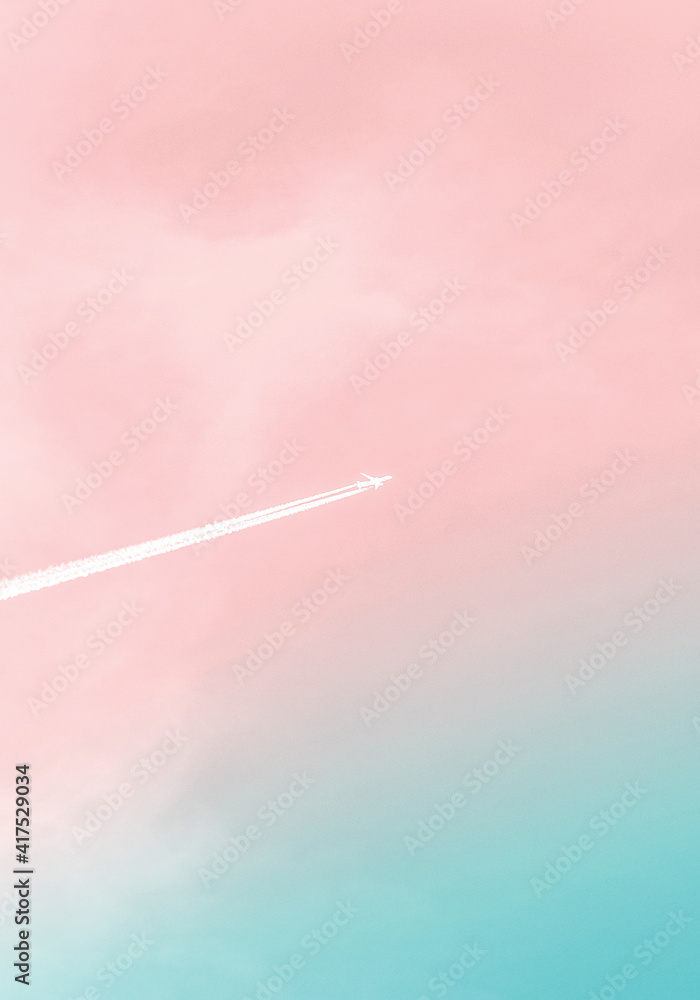 Inversion pink trail from a jet plane in the sunset sky. Aircraft ...