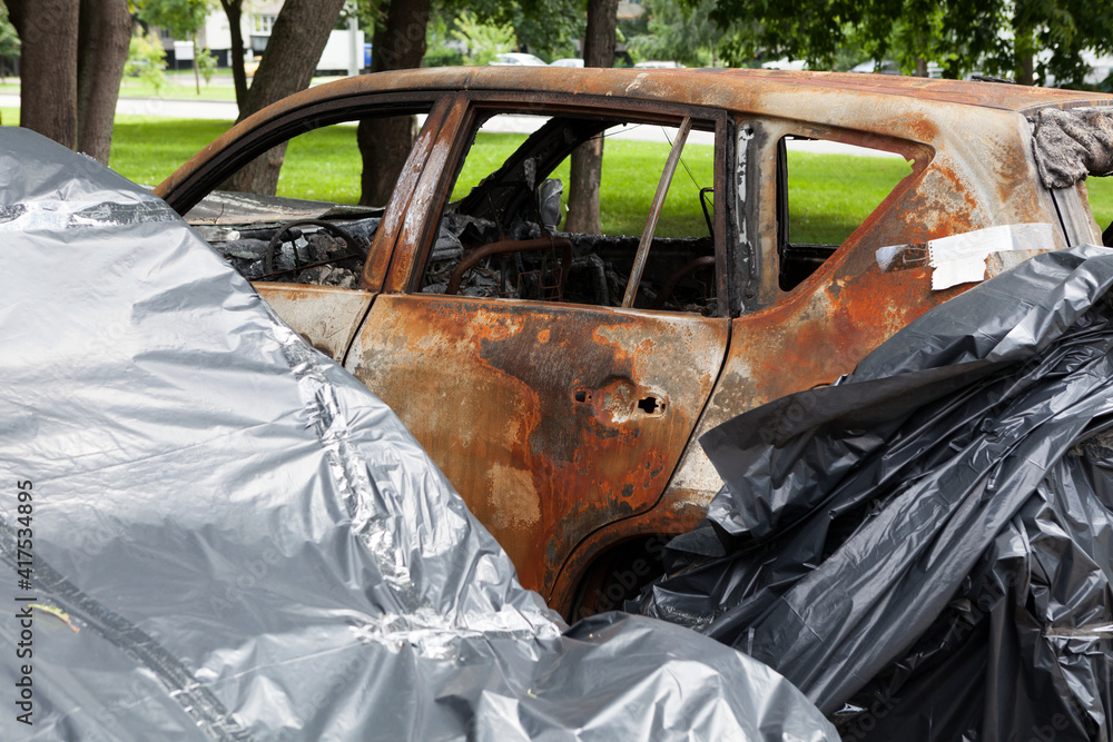 Burnt-out car, side view. Fire completely destroyed the interior of car ...