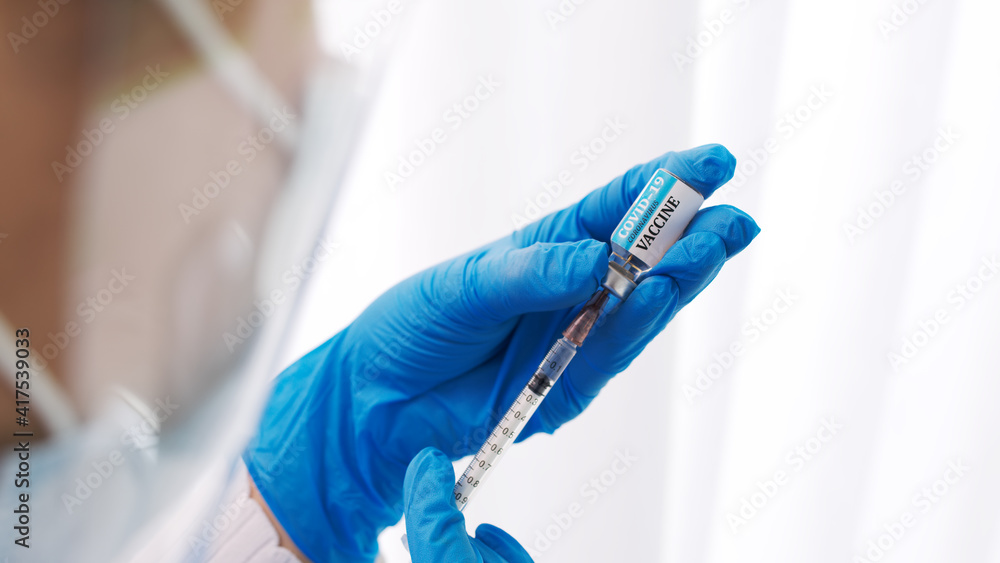 Close up hand of doctor or researcher with face mask holding and ...