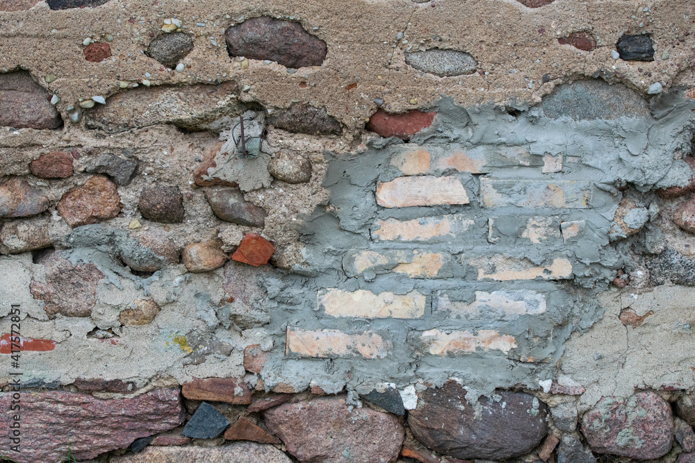 Poor wall repair for an old wall with a modern approach. Stock Photo ...