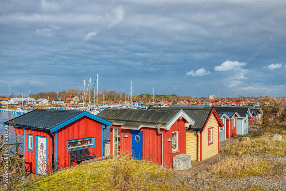 A coloured village depicts row of Nordic summerhouses (Swedish ...