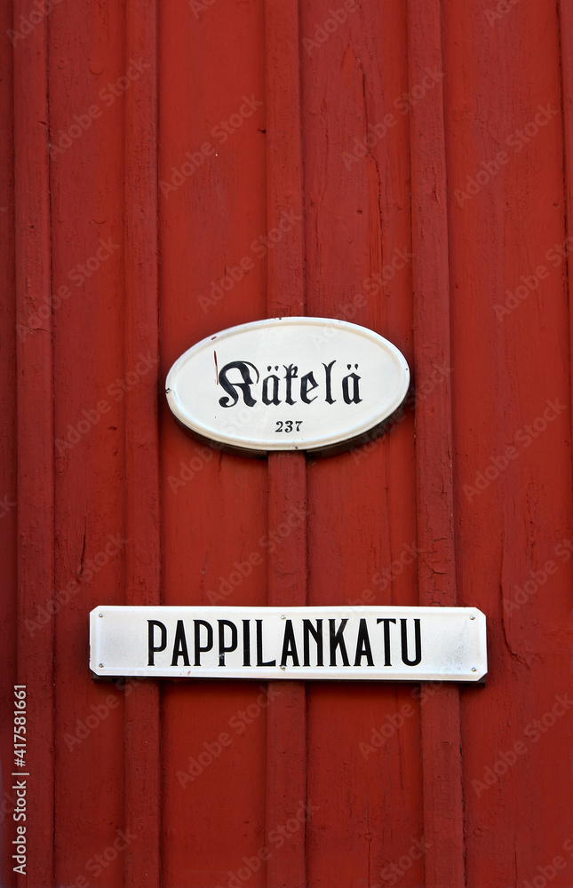 The wooden facades and street signs in Old Rauma. Rauma is one of the ...