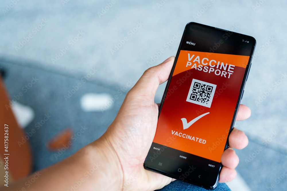 Smartphone displaying a valid digital vaccination certificate for COVID ...