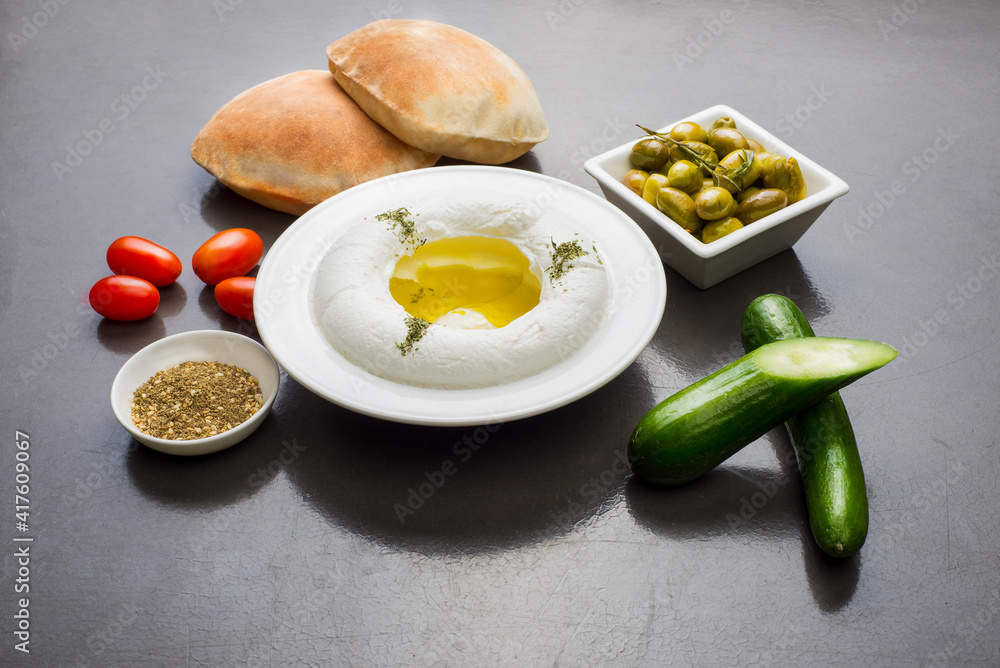 Lebanese food of Labneh Yogurt cheese with Olives and veggies. Stock ...