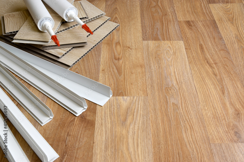 Set of items for PVC ceiling indoor works. Assembly adhesive bottles ...