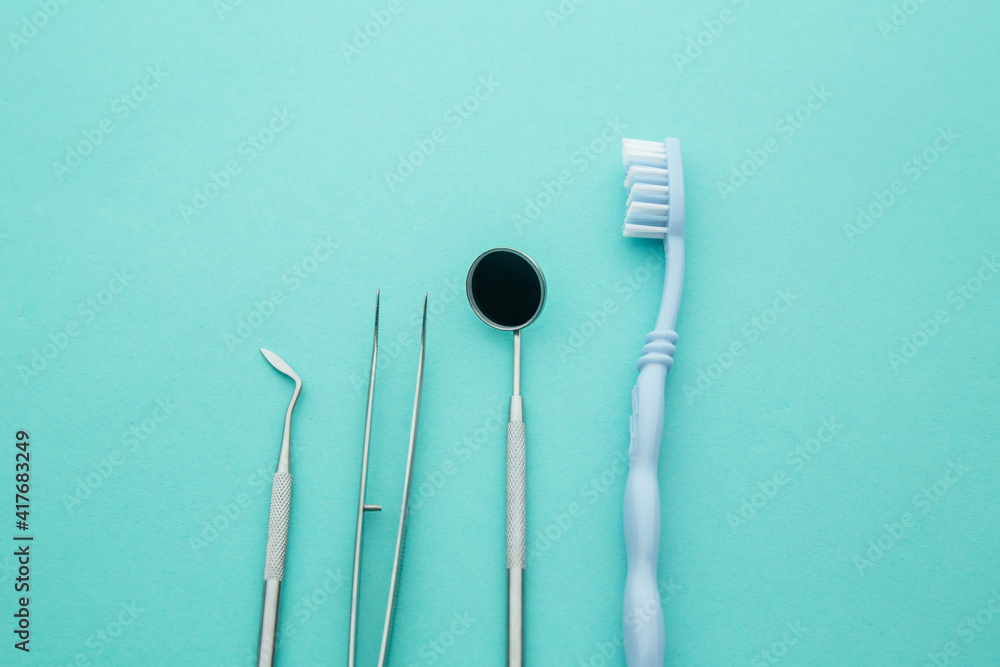 Dentist tools close-up. Professional steel dental instruments with a ...