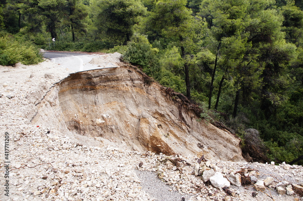 Landslide. Damaged roads and fallen rocks after a heavy storm on ...