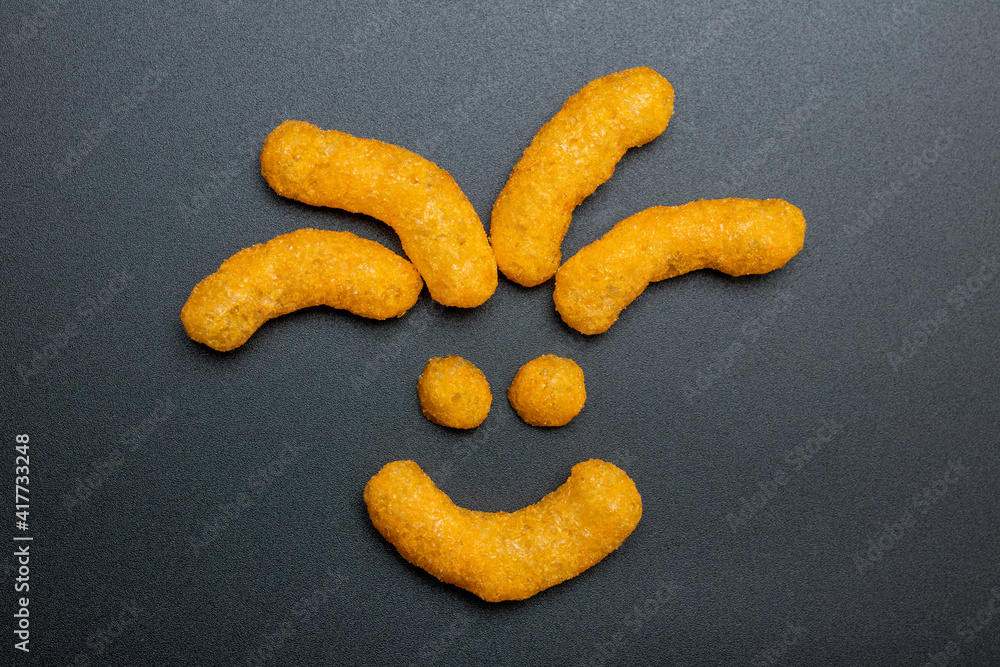 Cheese puffs, flat lay, Cheese Doodle Day, grin, face made of crisps ...