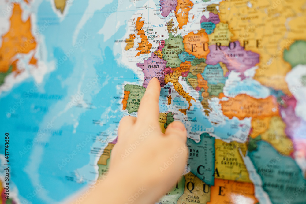 Human woman man hand pointing out to Europe country on map. Travel ...