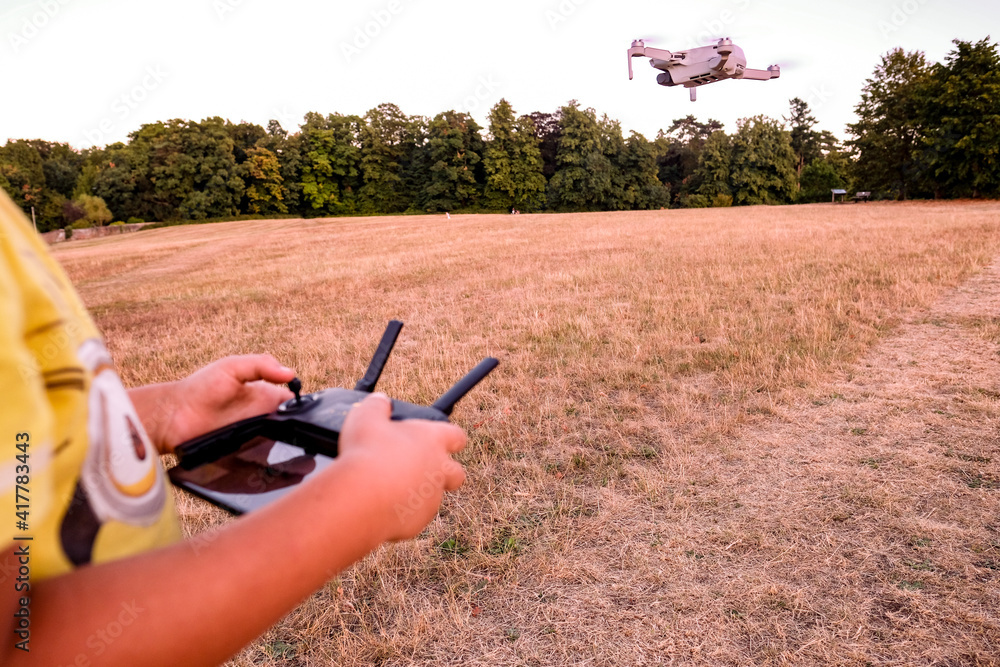 Point of view perspective of young person flying a drone Stock Photo ...