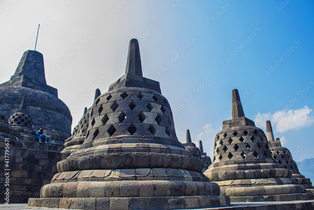 Buddhist stupas in ancient Borobudur temple, Magelang, Central Java ...