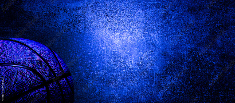 Basketball ball on neon light on concrete wall texture background ...