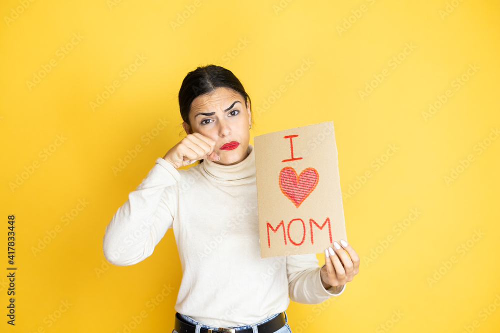 Beautiful woman celebrating mothers day holding poster love mom message ...