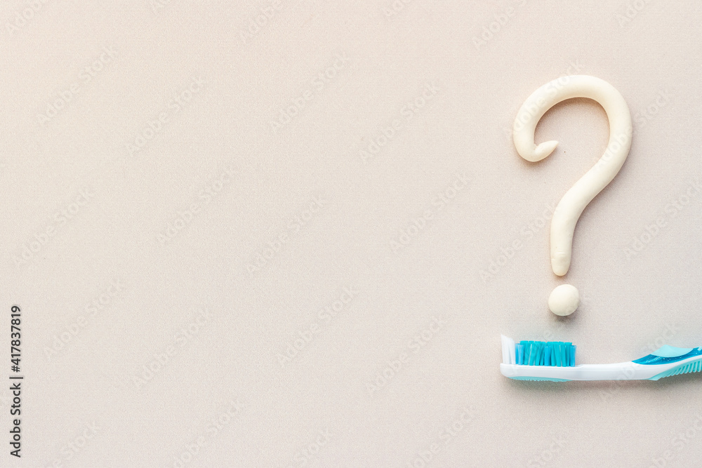 Question mark of toothpaste with toothbrush, top view. Oral care and ...